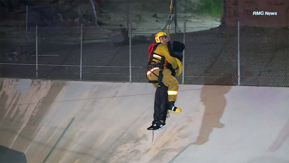 Firefighters Rescue Two People Who Were Swept Down LA River Channel ...