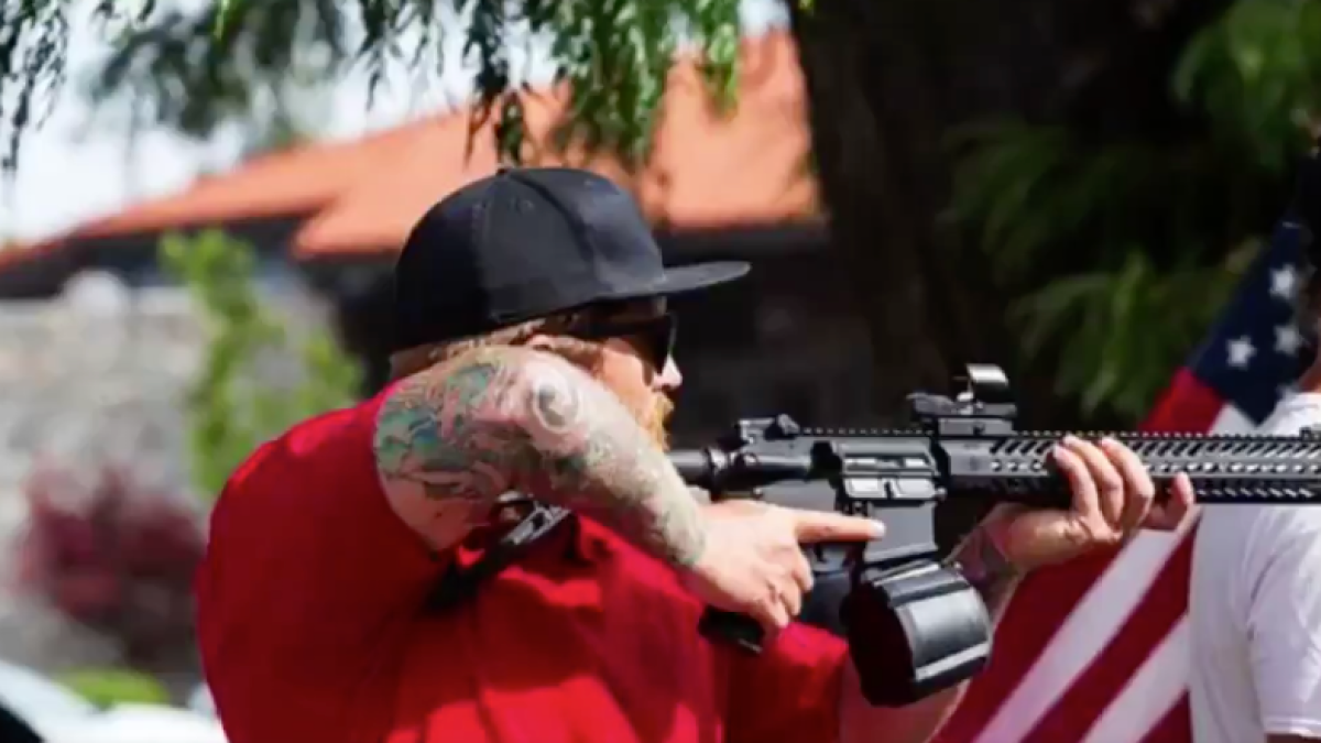 Man Caught on Camera Brandishing Rifle at Protest Charged With Assault ...