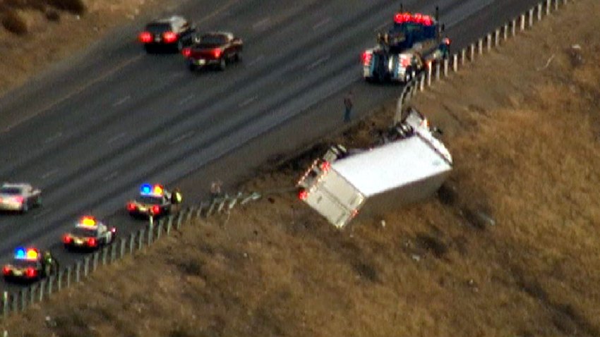 Big Rig Crashes Through Guardrail On Top Of Freeway Embankment Nbc