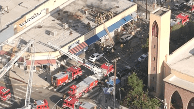 Watch: Firefighters attack fire at downtown LA commercial building ...