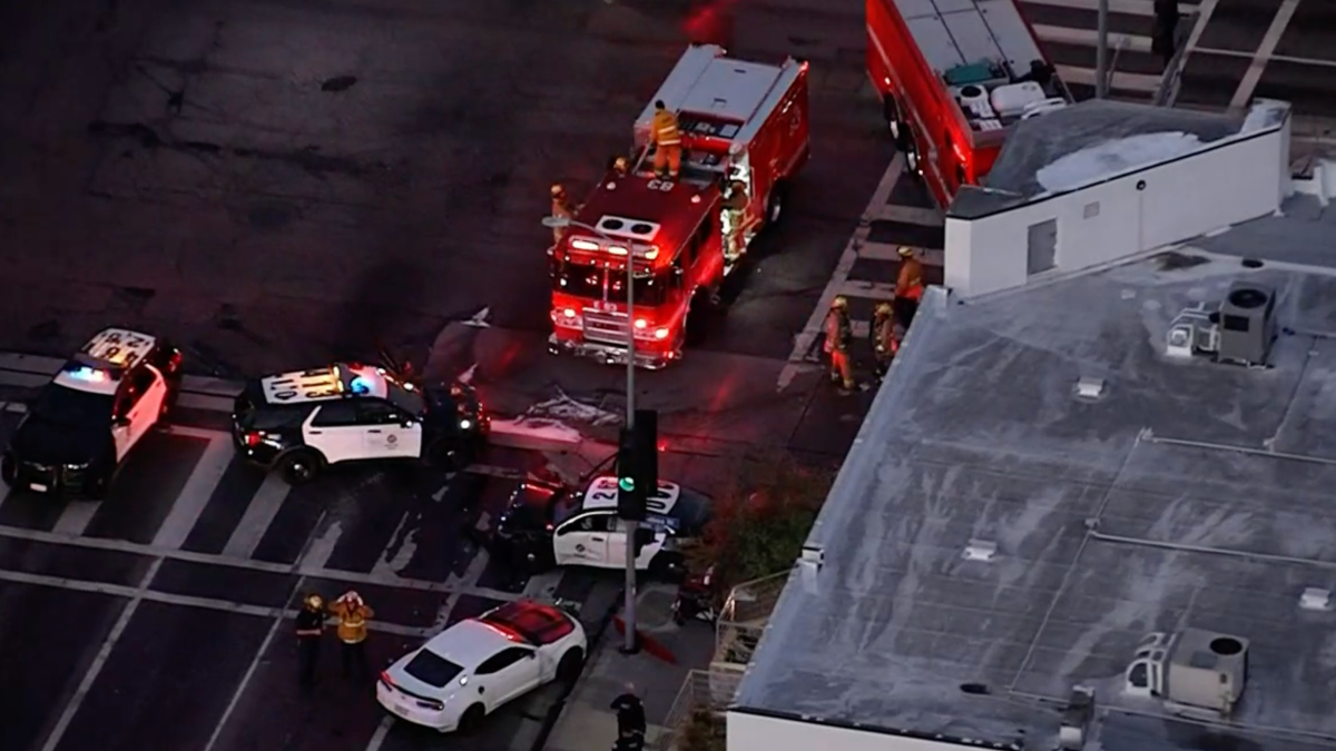 Multiple injured after three-car collision involving police unit in ...