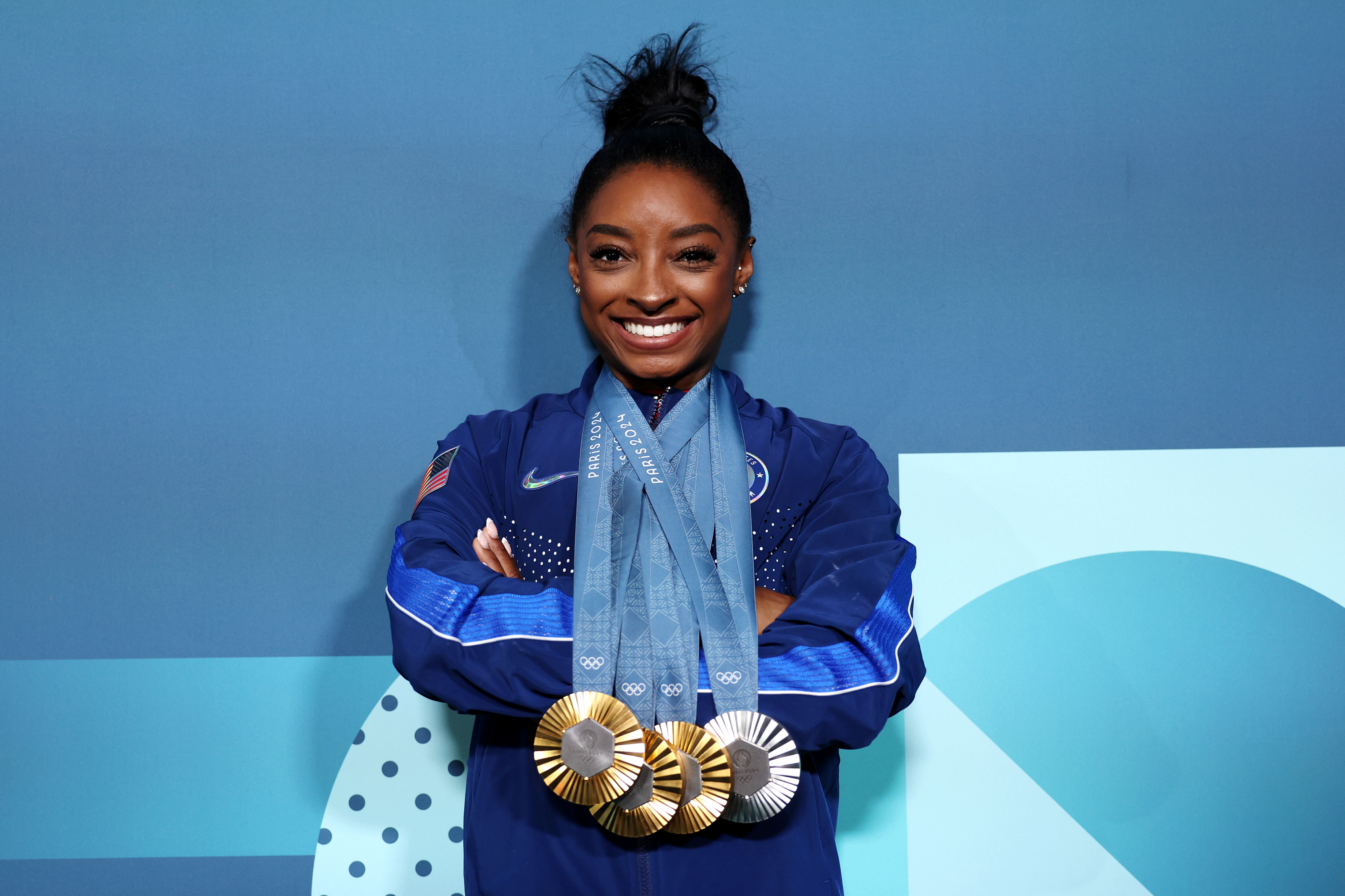 Simone Biles poses with her 11 Olympic medals in new photos – NBC Los ...