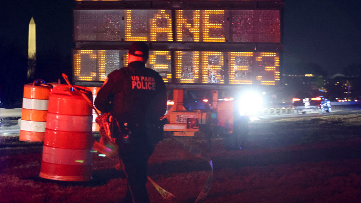 Photos: Massive response to crash of commercial jet, helicopter into ...