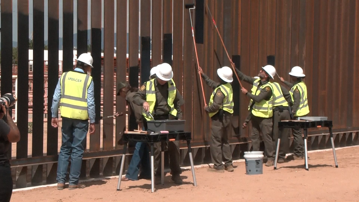 Trump orders entire border wall be painted black to make it too hot to ...